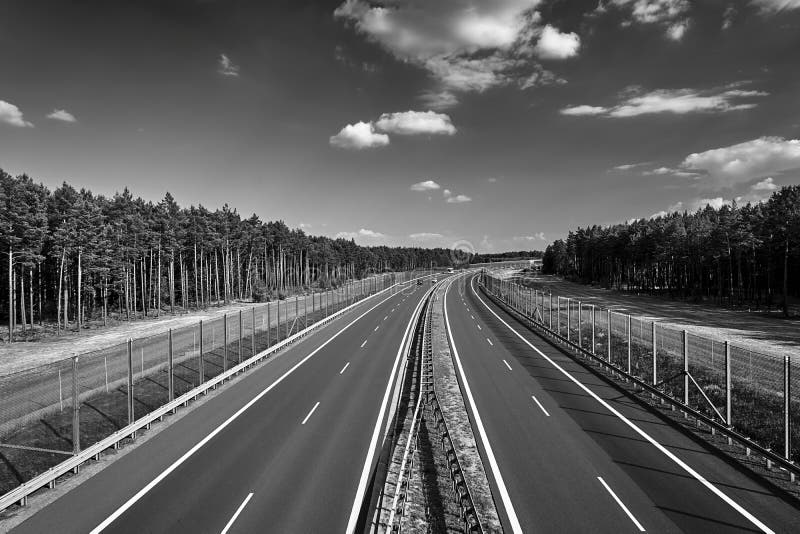 A Two-lane Asphalt Expressway Crossing the Forest Stock Photo - Image ...