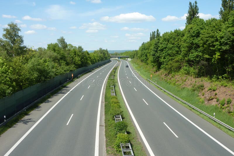 Two-lane highway with cars stock photo. Image of facility - 36253360