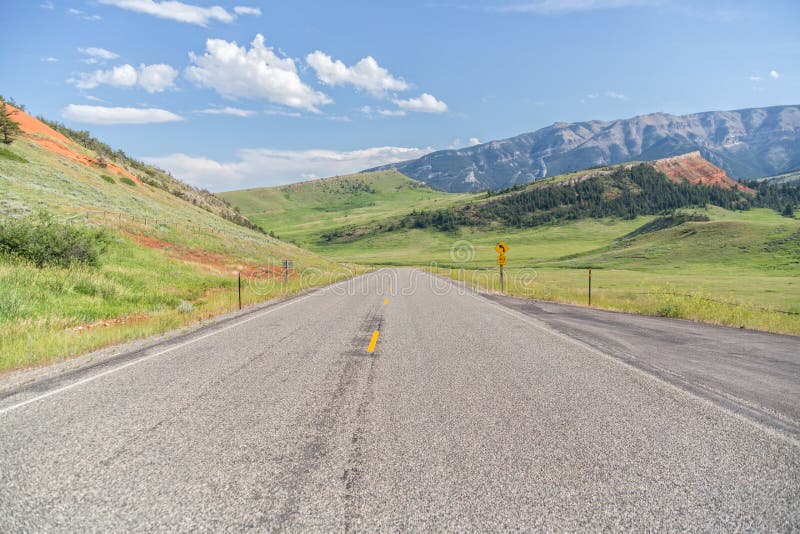 Paved Two Lane Road Crossing Mountains And Forest In Scenic Alpine ...