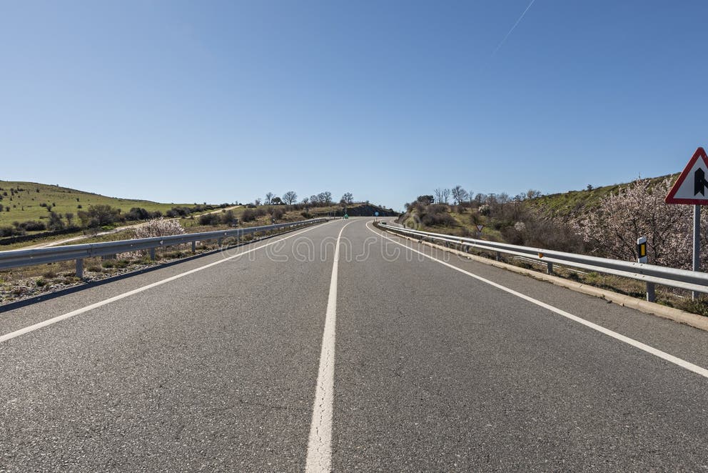 A Two-lane Road with One Lane in Each Direction with a Solid White Line ...