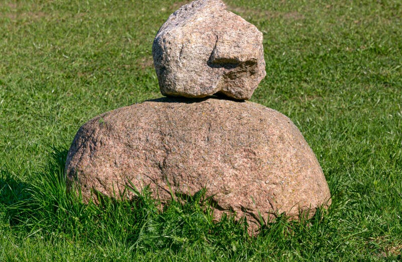 Two Large Granite Stones in a Field on the Grass. Stock Image - Image ...