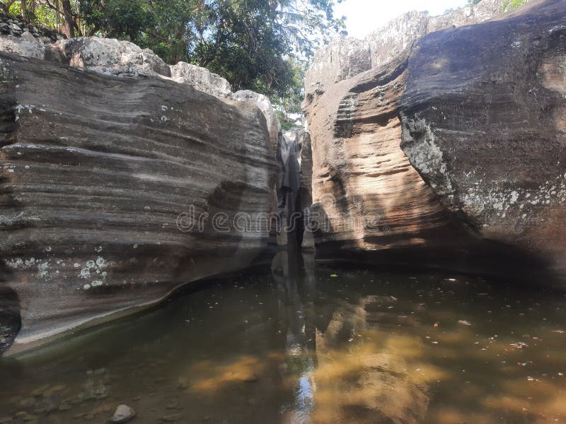 The Two Large Light Brown Rocks Formed by the Flow of River Water Look ...