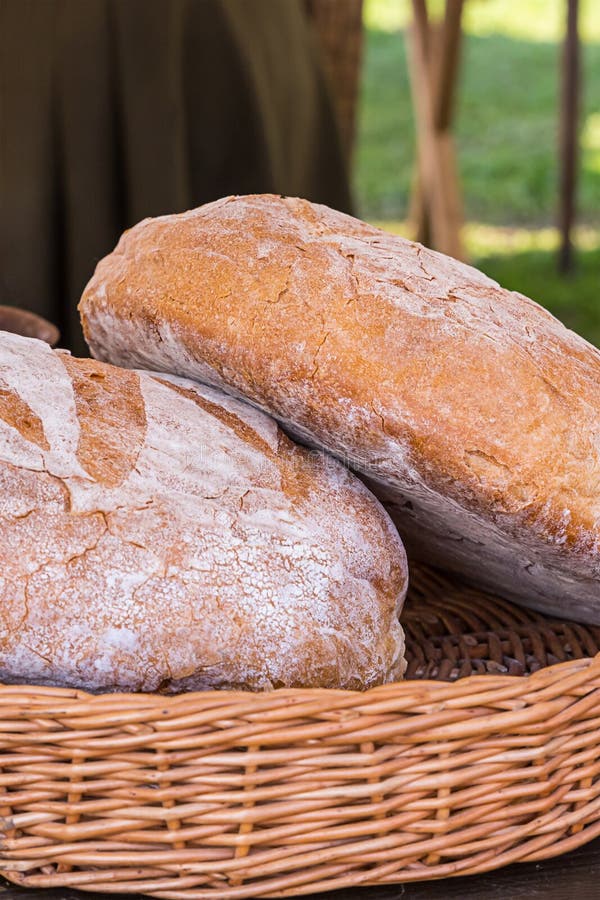 Two Large Oval Bread Rustic Appetizing Delicious in a Wicker Tray Close ...