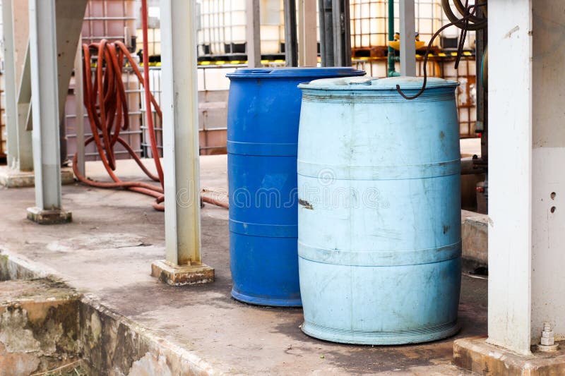 Two Large Plastic Barrels Sitting in an Industrial Area Showcasing ...