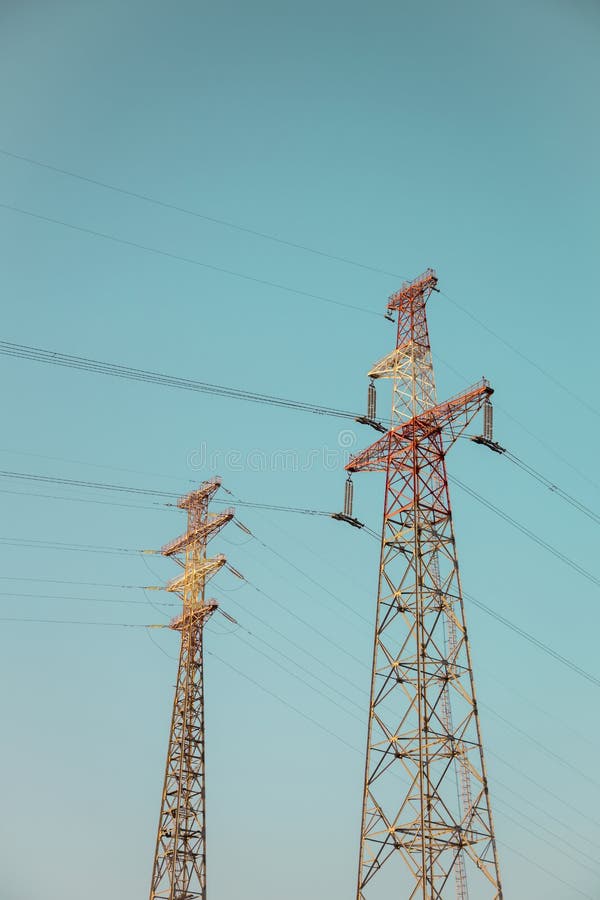 Two Large Rectangular High-voltage Electrical Transmission Towers with ...