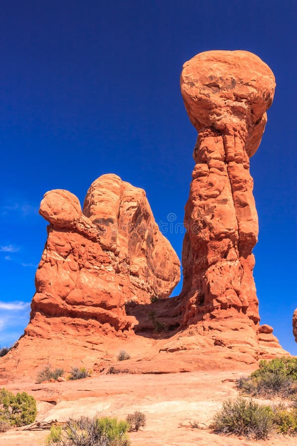 Two Large Rock Formations, One of Which is Shaped Like a Human Head ...