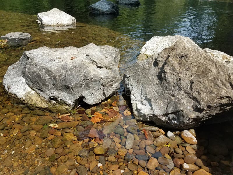 Two Large Rocks in a Stream Stock Image - Image of gray, stream: 97494477