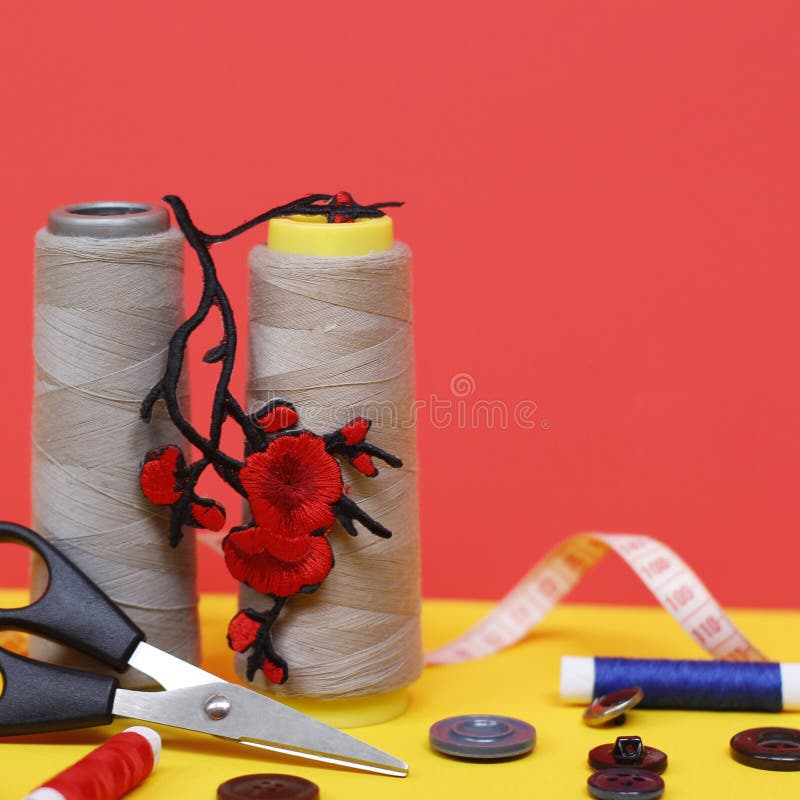 Two Large Spools of Thread are Standing, Many Small Spools are Lying ...