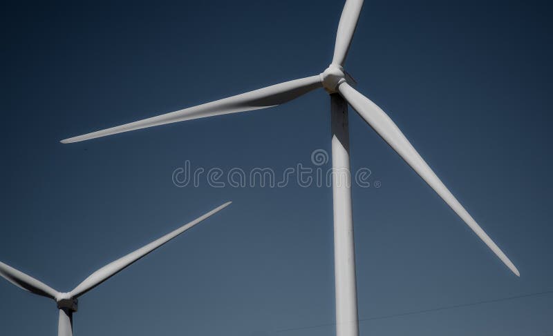 Wind Turbines Spinning in a Strong Wind Stock Photo - Image of ...