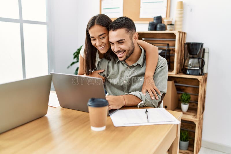 Two Latin Business Workers Smiling Happy and Hugging Working at the ...