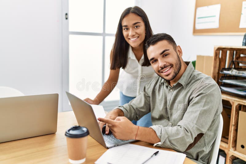 Two Latin Business Workers Smiling Happy Working at the Office Stock ...