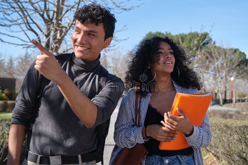 Two Latin Students Talking and Smiling at the College Campus Stock ...