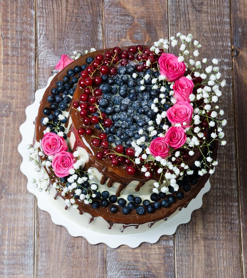 Two Layered Color Drip Wedding Cake with Bilberries, Red Currant Stock ...