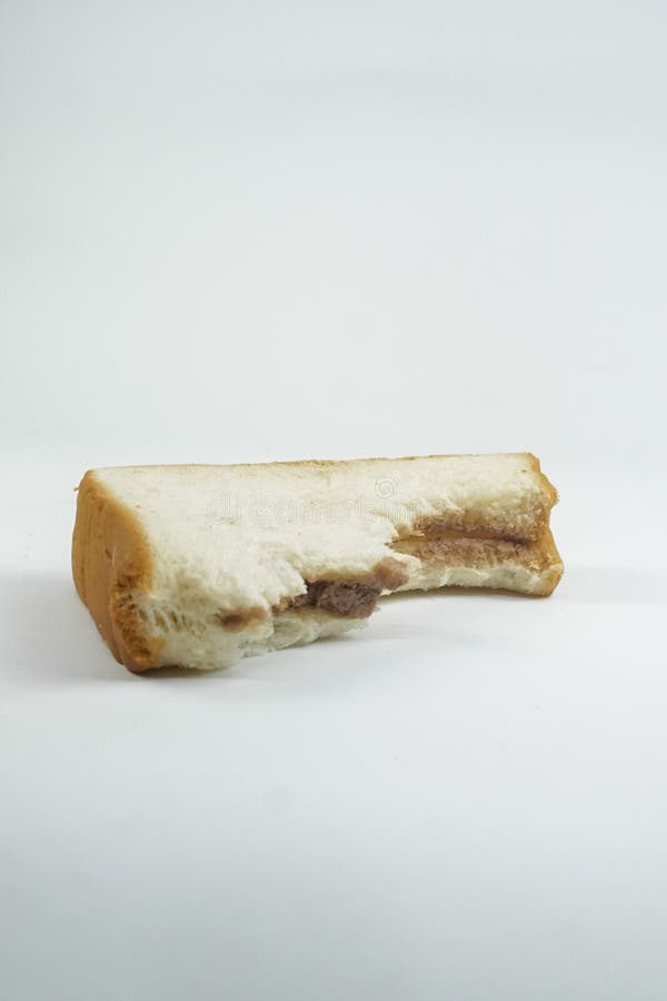 Two Layers of White Bread with Bite Marks on a White Background Stock ...