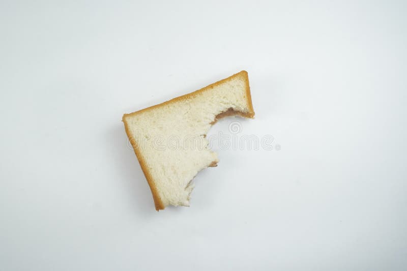 Two Layers of White Bread with Bite Marks on a White Background Stock ...