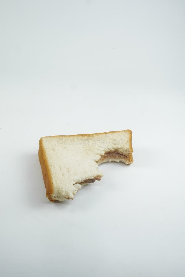 Two Layers of White Bread with Bite Marks on a White Background Stock ...