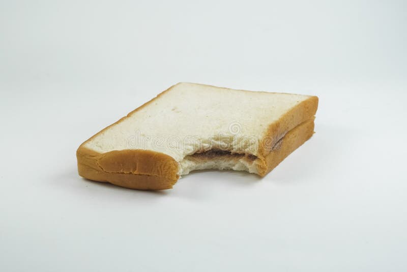 Two Layers of White Bread with Bite Marks on a White Background Stock ...