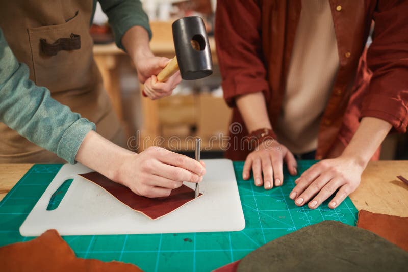 Two Leather Craft Workers stock image. Image of working - 174785617