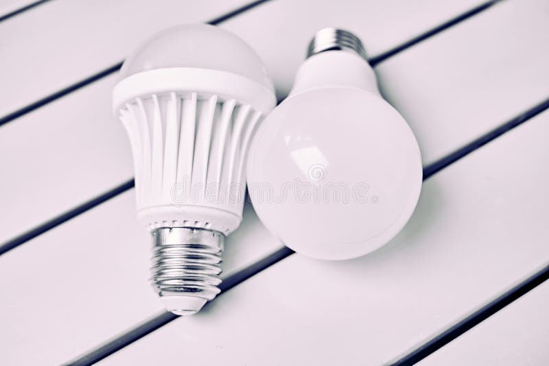 Two LED Bulbs on a Striped Table Stock Photo - Image of clipart ...