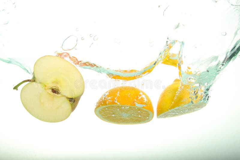 Two, Lemon and Apple Slices Splash of Water on White Background Stock ...