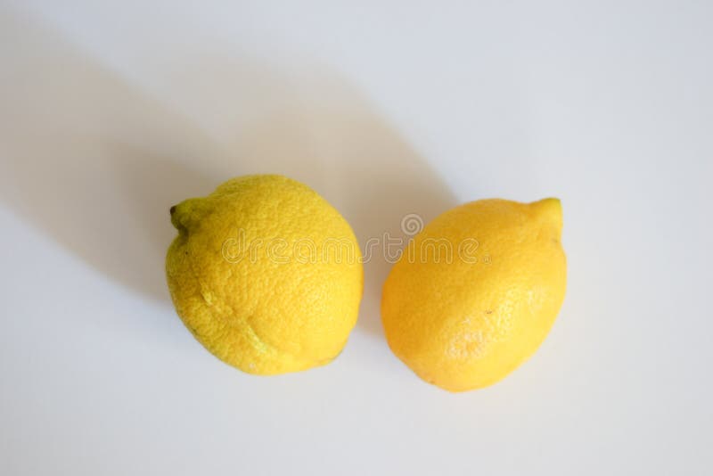 Two lemons stock image. Image of fruit, ingredients, yellow - 57069069