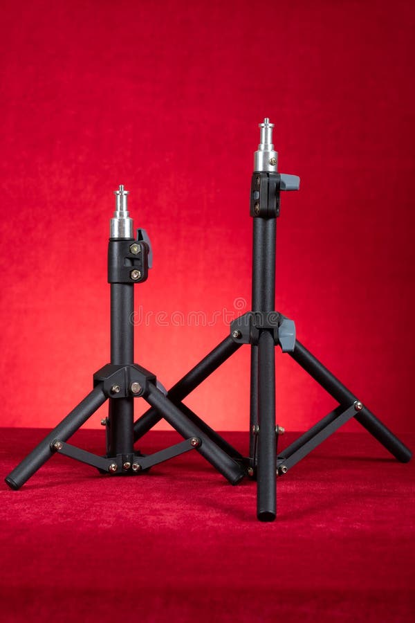 Two Light Stands for Photography on Red Background Vertical Composition ...