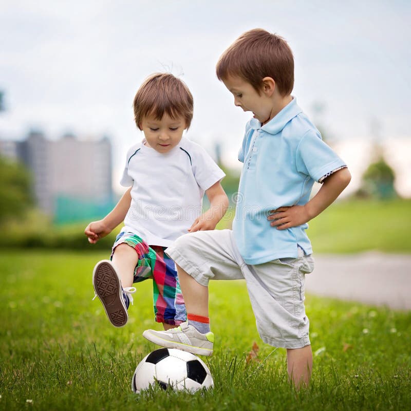 Two Little Boy, Playing Football Stock Image - Image of action, hunt ...