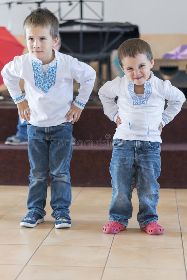 Two Little Boys Perform on Stage in Kindergarten or School. Performance ...