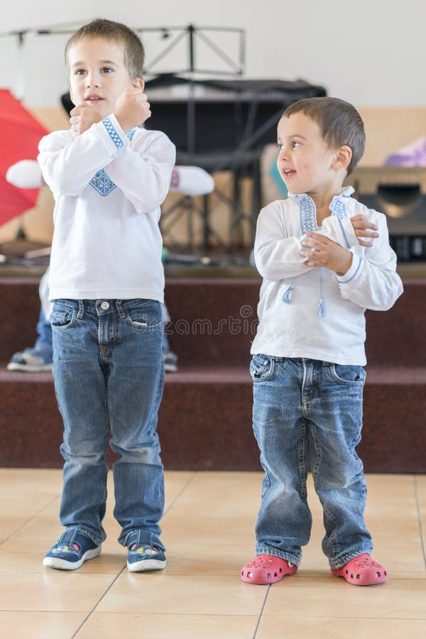 Two Little Boys Perform on Stage in Kindergarten or School. Performance ...