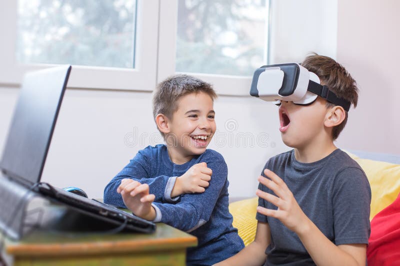 Two Little Boys Playing Games on Computer Stock Photo - Image of child ...