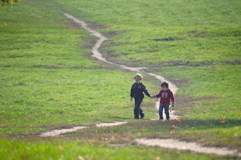 Two Little Boys Walking Together on the Path Stock Image - Image of ...