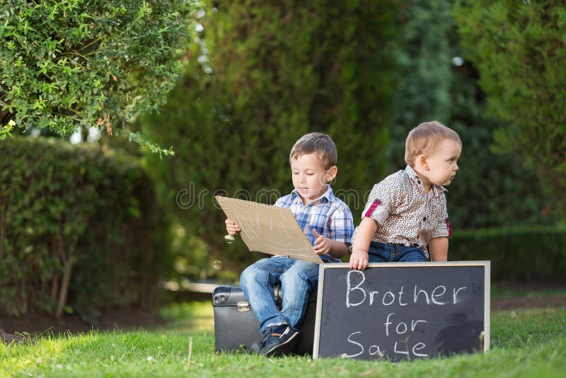 Two Little Brothers in the Park Stock Image - Image of boxwood, park ...