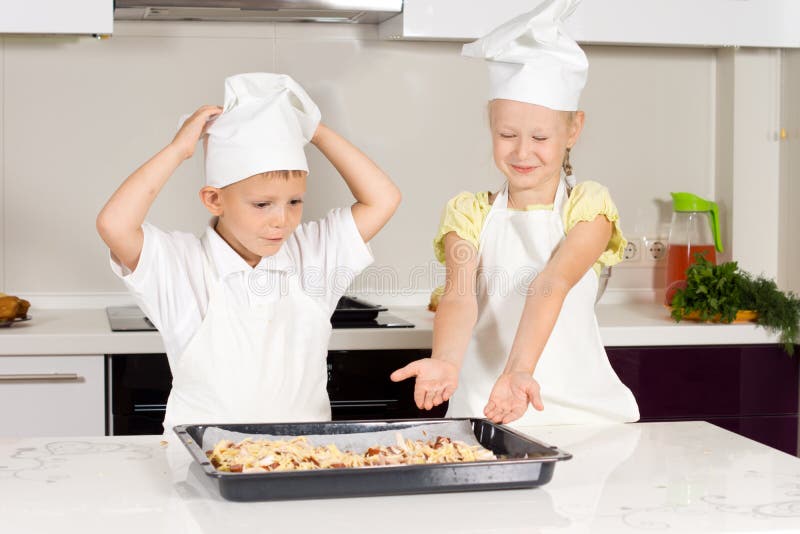 Two Little Chefs Bake Food for Lunch Stock Image - Image of children ...