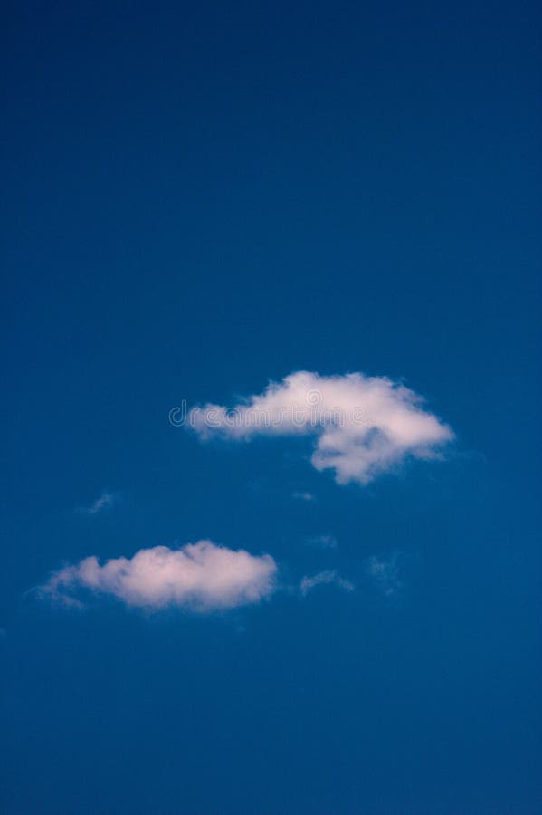 Two Little Clouds in the Sky Stock Image - Image of color, climate ...