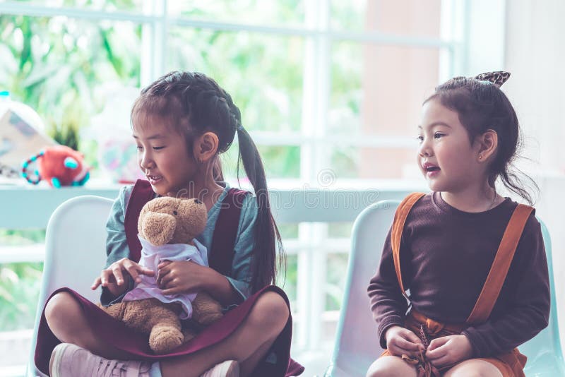 Two Girl Sitting in Classroom Together Stock Image - Image of lovely ...