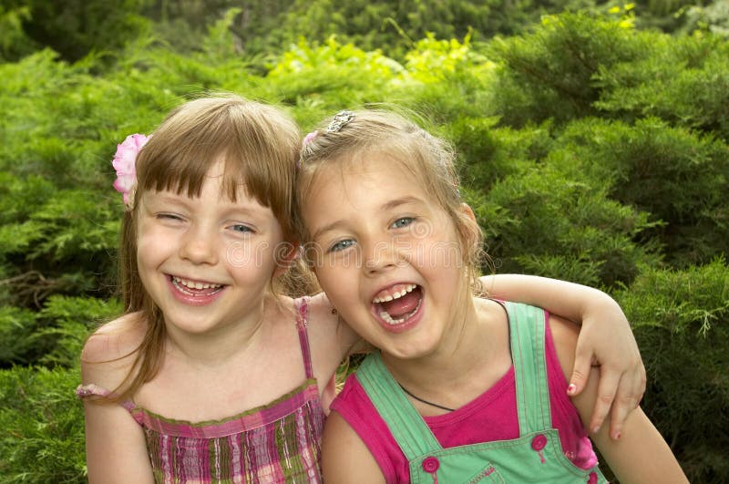 Two little girls stock image. Image of grass, kids, childhood - 15709295