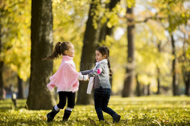 Two Little Girls at the Autumn Park Stock Image - Image of child ...