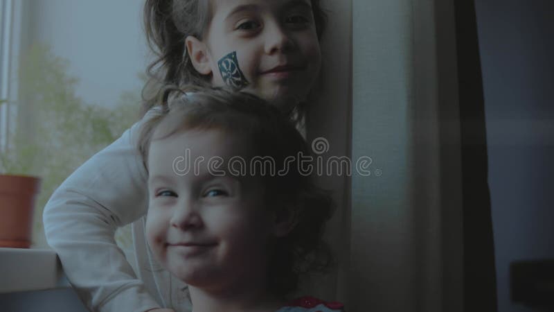 Two Little Girls with Computer Components Paintings on Their Faces ...