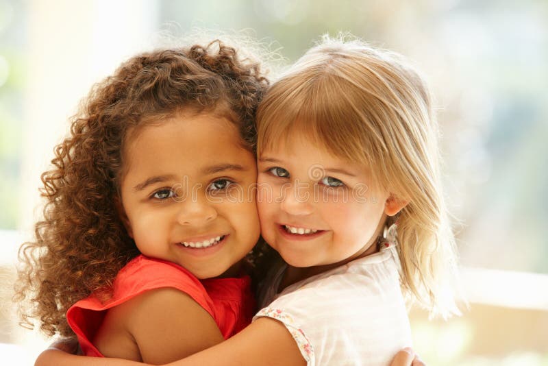Two little girls hugging stock image. Image of happy - 54956025