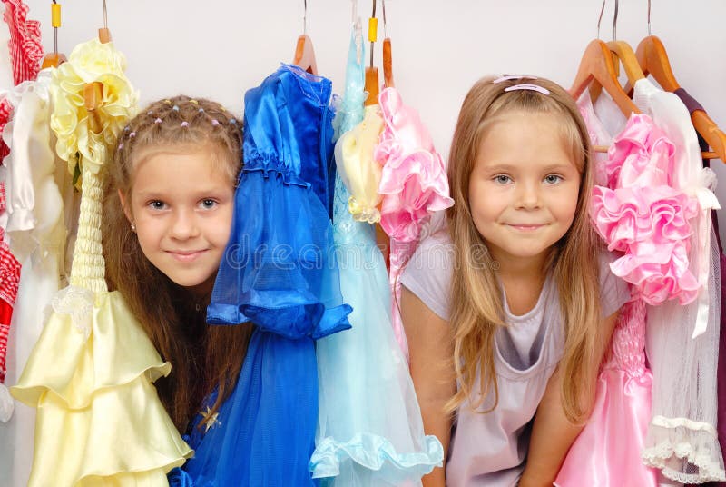 Two Little Girls in Shop of Dresses Stock Photo - Image of consumer ...