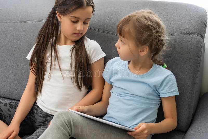 Two Little Girls with a Tablet Stock Image - Image of tablet, happy ...