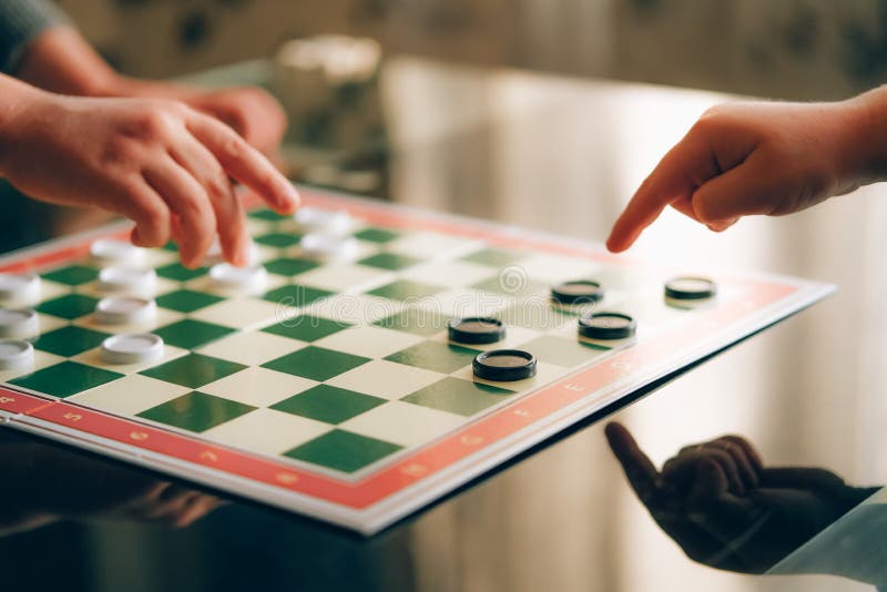 Two Little Kids Playing Draughts Board Game. Stock Photo - Image of ...