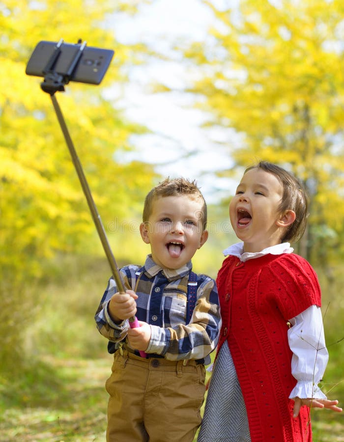 Two Little Kids Taking Selfie in Park in Autumn Stock Photo - Image of ...
