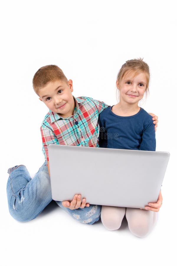 Two Little Kids Using a Laptop Stock Photo - Image of looking, amusing ...