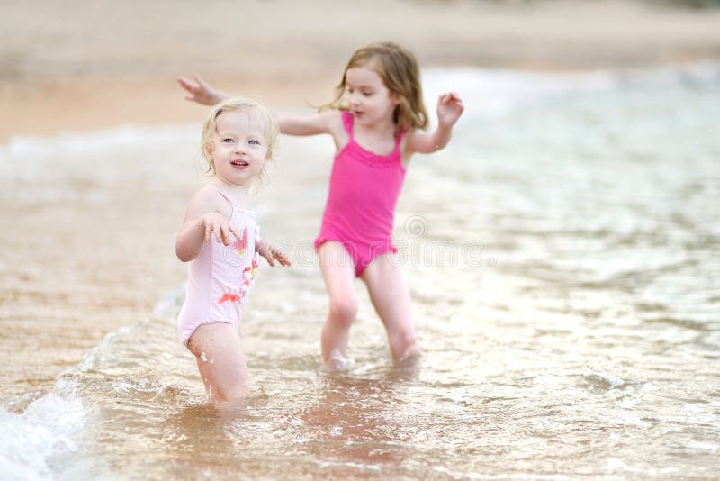 Adorable Little Girls Having Fun during Beach Stock Photo - Image of ...