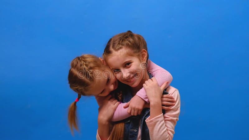 Two Little Sisters Hugging and Smiling Stock Video - Video of children ...