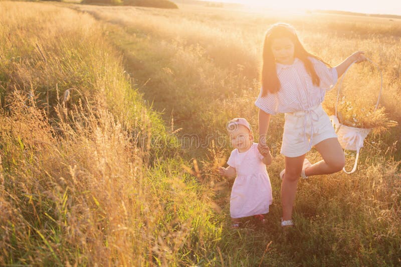 Little Sisters in Summer Field at Sunset Stock Image - Image of outside ...