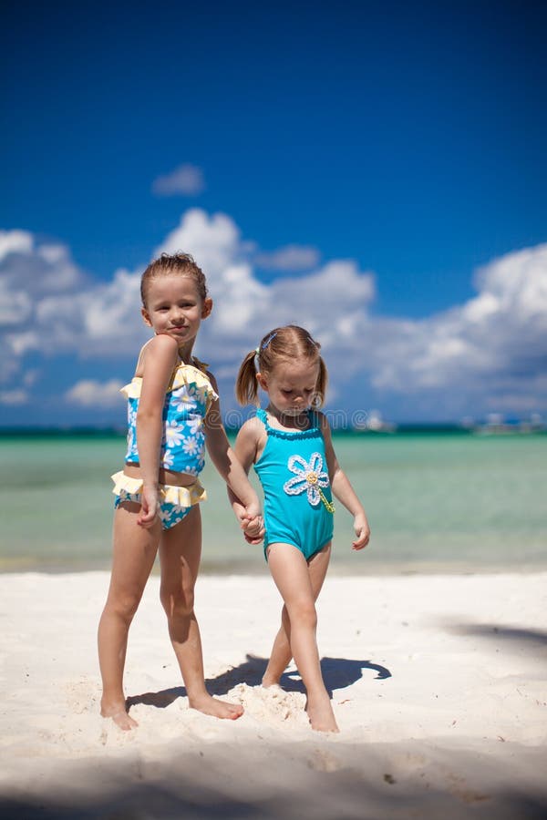 Two Little Sisters at Tropical Beach Stock Photo - Image of caribbean ...