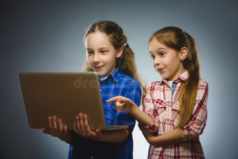 Cute Wondering Or Stressed Girl Using Laptop Isolated Grey Background