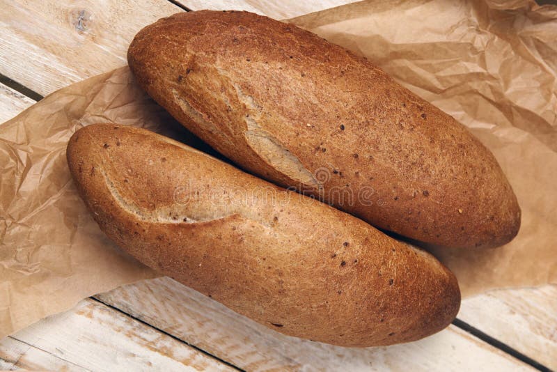 Two Loafs of Handmade Bread on a Wooden Table Stock Photo - Image of ...